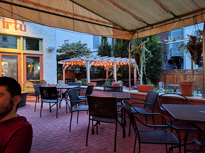 The outdoor patio at dusk feels like stumbling upon a secret garden party in Abruzzo. Those twinkling lights promise evenings that stretch deliciously into the night.