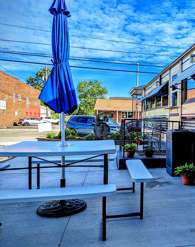 Outdoor seating for when you want your eggs with a side of fresh air. The blue umbrella matches the Pennsylvania sky on its best behavior.