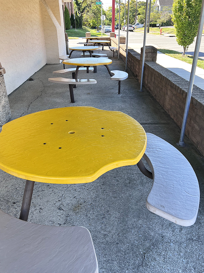 Yellow tables dot the outdoor seating area like buoys in a concrete sea. Perfect for enjoying your catch on a sunny Ohio day.