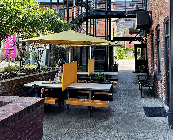 Outdoor seating that feels like a secret garden in the city. Urban al fresco dining where conversations flow as freely as the tahini.