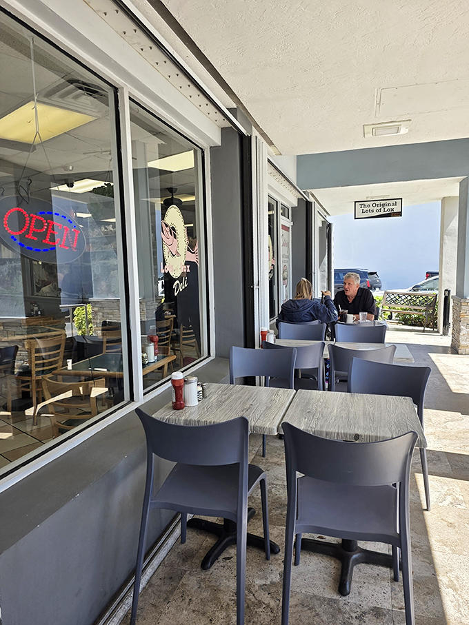 Outdoor seating that says, "We're in Florida, might as well enjoy it." Nothing fancy, just fresh air and the promise of imminent satisfaction.