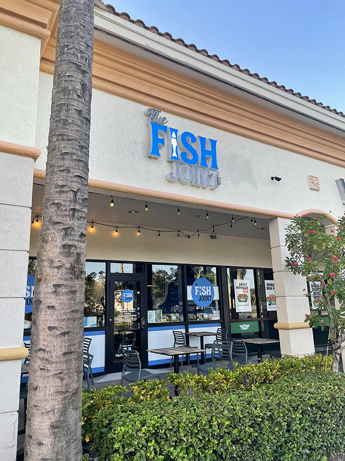 String lights and palm trees frame the entrance like nature's red carpet, inviting you to the seafood show that's always getting five-star reviews.