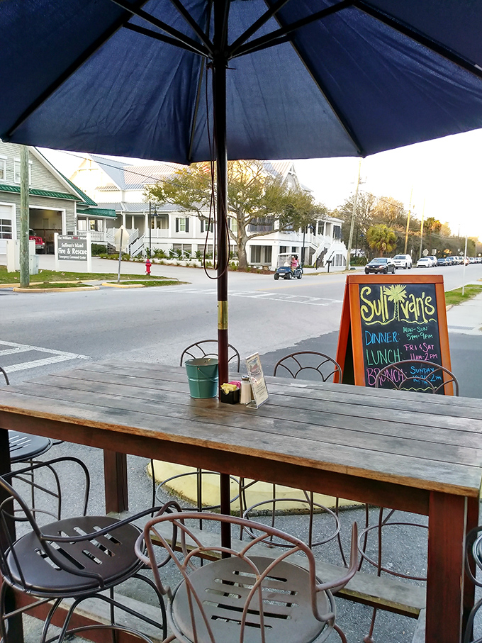 The outdoor seating area offers front-row tickets to Sullivan's Island life&mdash;where sea breezes enhance every bite and coastal living unfolds before you.