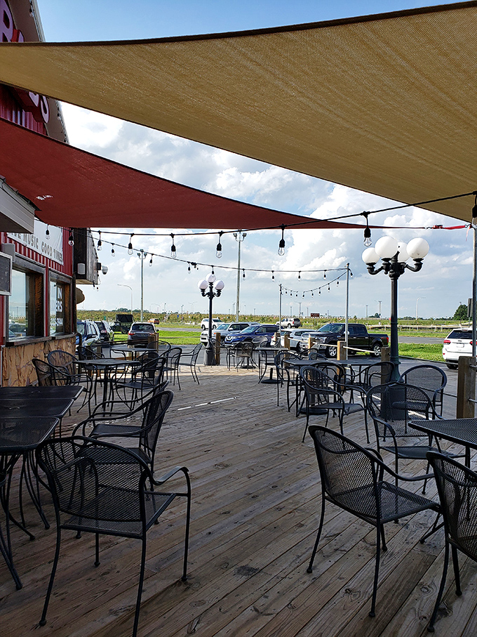 The outdoor seating area&mdash;where fresh air enhances fresh seafood. Those shade sails aren't just practical; they're setting the stage for memorable meals. 