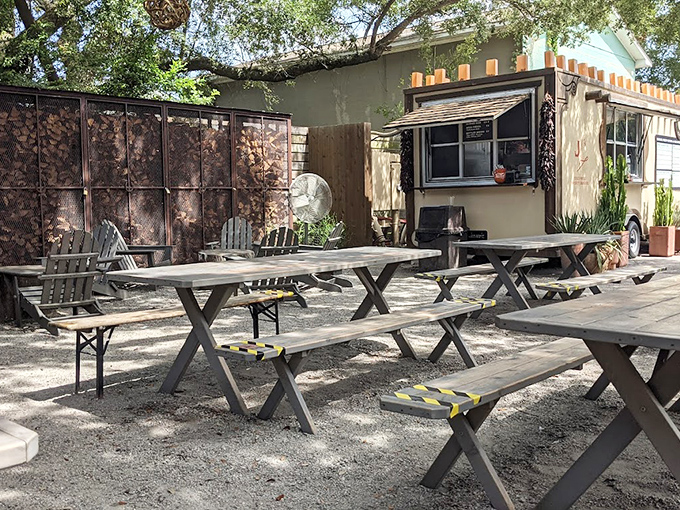The outdoor seating area&mdash;where picnic tables await under dappled shade, ready for the serious business of Texas-style feasting.