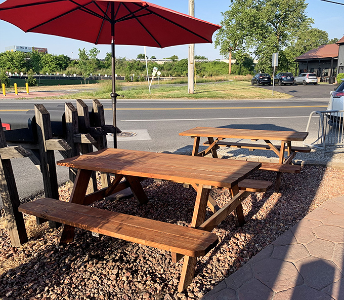 The outdoor seating area: where strangers become friends united by the universal language of "mmm" and "you have to try this." Red umbrellas optional, satisfaction guaranteed.