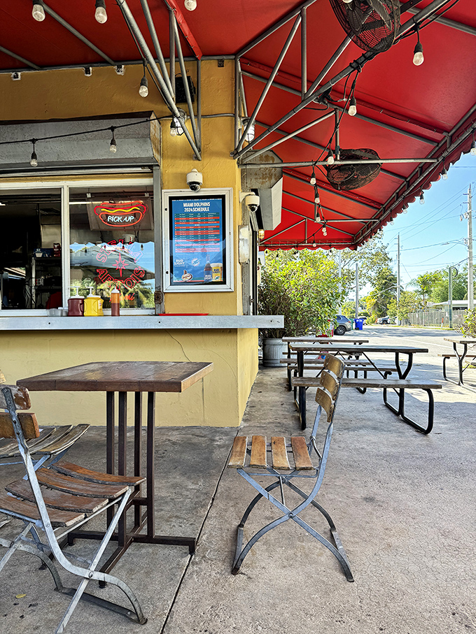 Al fresco dining, Miami style. Simple wooden tables and chairs create the perfect stage for the real star of the show&mdash;whatever delicious creation is on your tray.