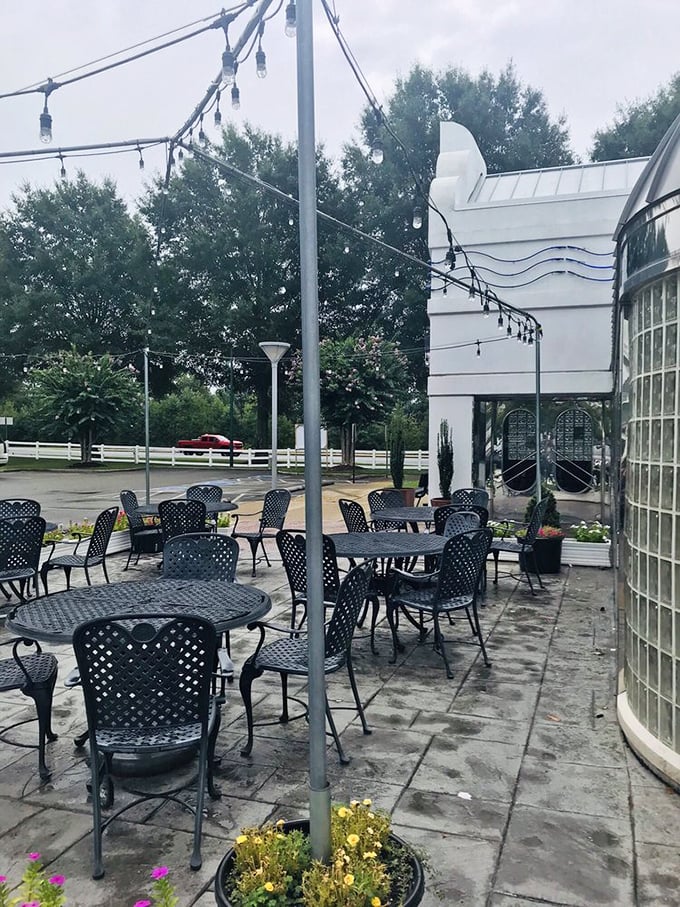 The outdoor patio where fresh air enhances fresh flavors. String lights overhead promise to illuminate evening conversations long after the plates are cleared.