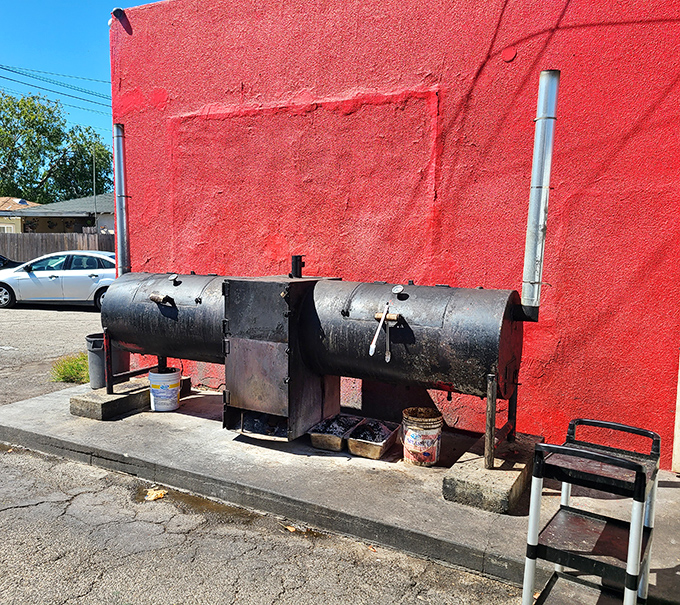 The smoker&mdash;blackened by years of service&mdash;is the true heart of any BBQ operation. This one's earned its battle scars.