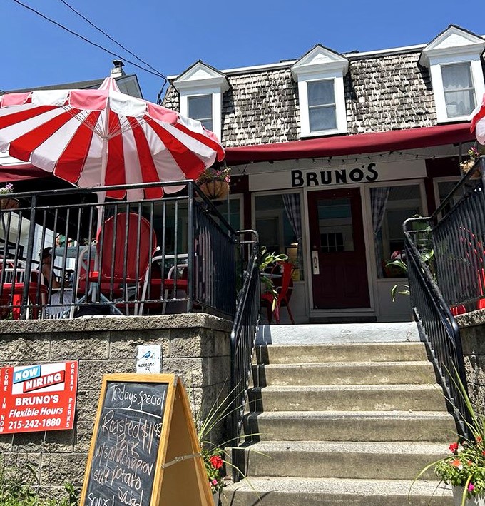 Bruno's exterior view showcases its perfect blend of homey charm and neighborhood fixture status. Those red and white umbrellas aren't just decorative &ndash; they're beacons of breakfast hope.