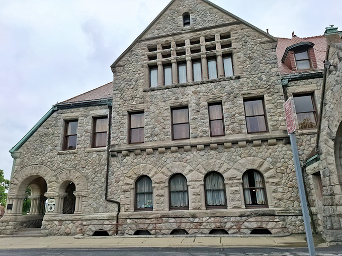 The mansion's exterior reveals the architectural equivalent of a power move – fieldstone walls and arched windows declaring "We've arrived" in the language of limestone.