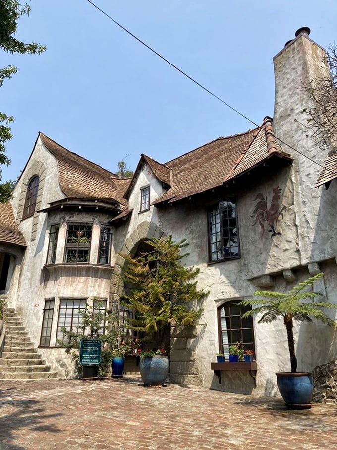 The village's exterior details reward those who look closely. That rooster emblem isn't just decoration—it's a character in the ongoing story of this architectural wonderland.