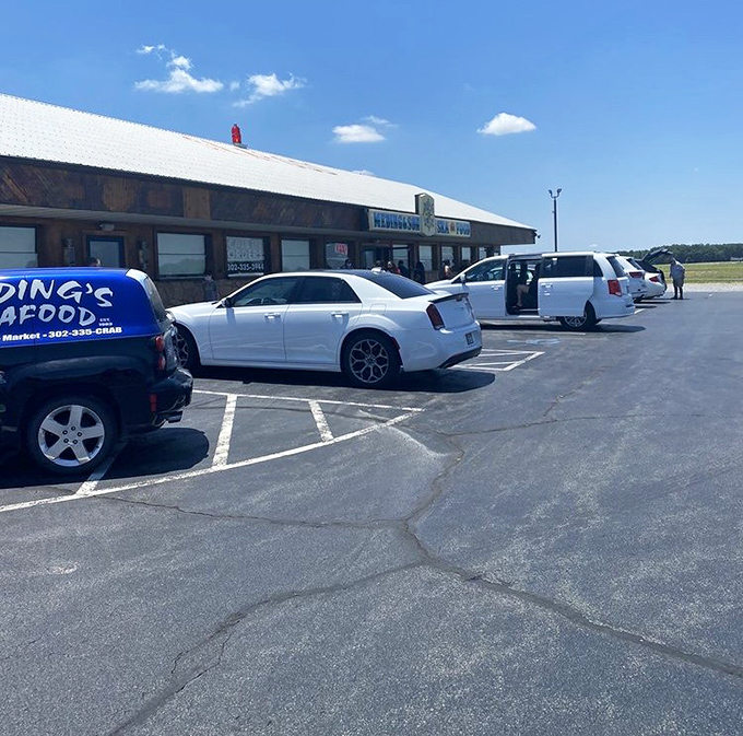 A parking lot filled with cars belonging to people making better lunch decisions than the rest of us. The full lot tells you everything you need to know.