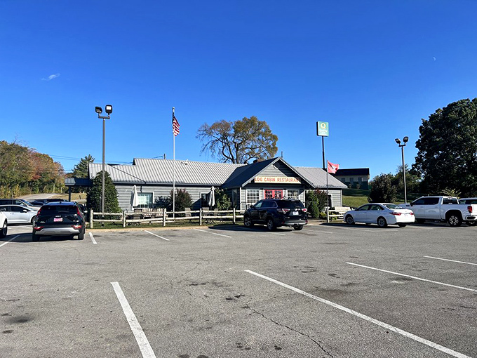 The parking lot view that promises salvation for hungry travelers. That American flag isn't just patriotic&mdash;it's signaling that real American food awaits inside.