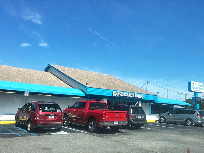The bright blue trim and welcoming parking area promise that inside this unassuming building, pancake magic awaits those wise enough to stop.