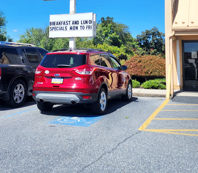 The parking lot sign announces breakfast and lunch specials with the straightforward honesty that's increasingly rare in our complicated world.