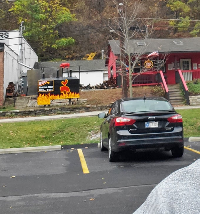 The view from the parking lot—where anticipation begins to build. Like spotting the roller coaster from the amusement park entrance, this sign promises thrills ahead.