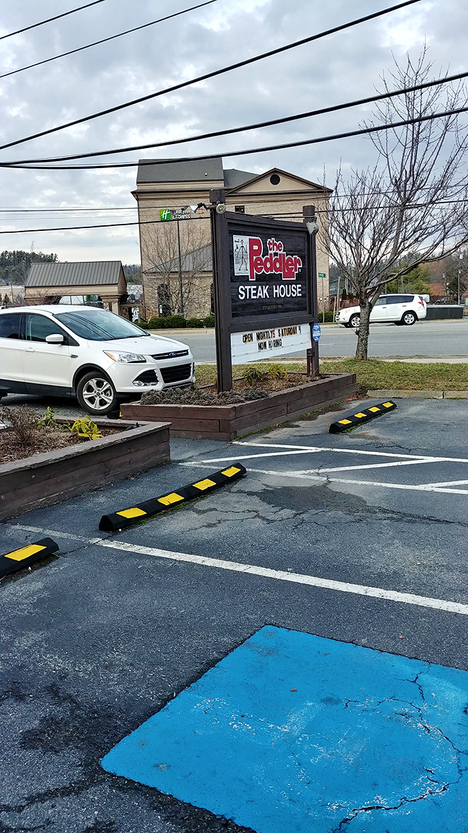 Even the parking lot has mountain charm. That sign promises carnivorous delights just steps away from where you leave your vehicle.