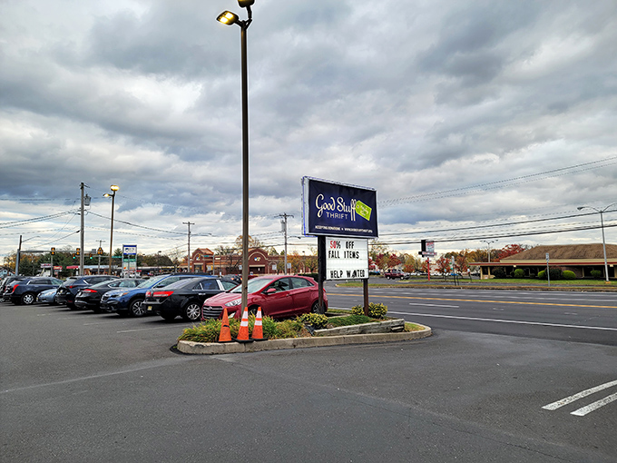 The parking lot: where ordinary cars wait while their owners transform into archaeological explorers of America's cast-off treasures inside.