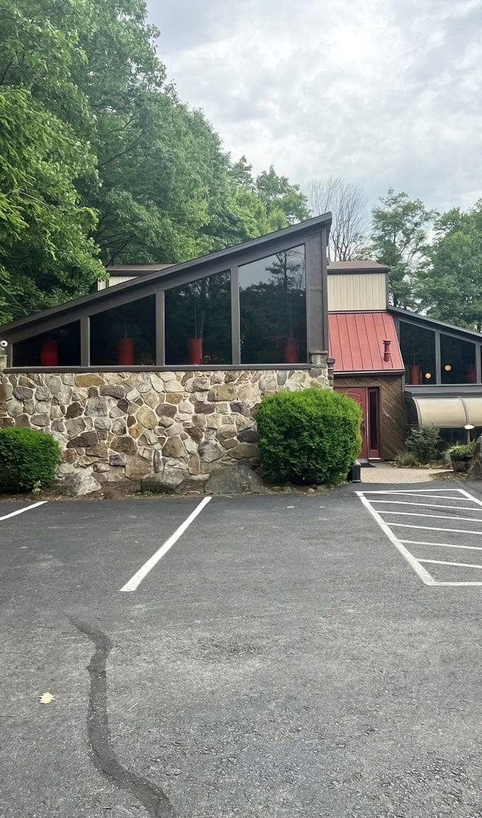 The modern A-frame design with stone foundation says "Yes, we're serious about architecture, but even more serious about what happens to meat inside."