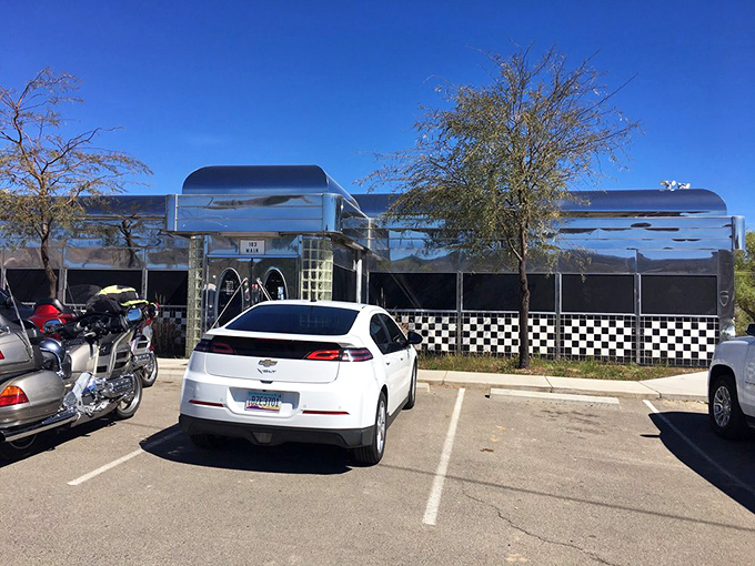 The parking lot tells its own story&mdash;motorcycles and cars gathered like hungry pilgrims at a chrome-plated shrine to American comfort food.