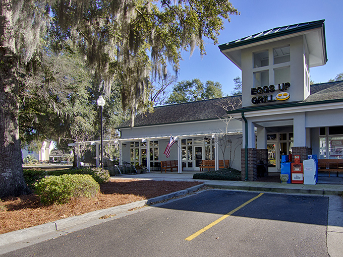 The morning pilgrimage begins in this parking lot. Your vehicle knows the way to happiness involves eggs, coffee, and Southern hospitality.
