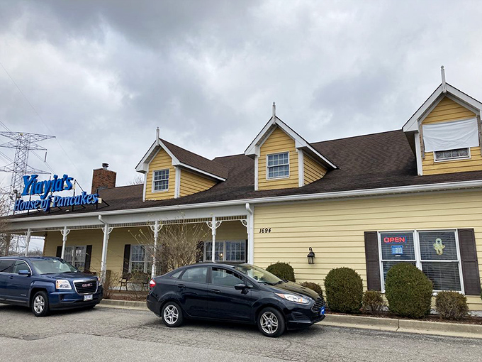 Even on cloudy days, Yiayia's yellow facade brightens the landscape, promising sunshine on a plate regardless of weather.