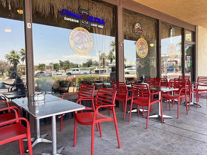 Al fresco dining, desert style. Those bright red chairs aren't just seating&mdash;they're front-row tickets to the Palm Desert people-watching show.