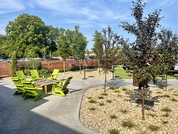 A patio designed for conversations that stretch into evening. Those lime-green chairs aren't just furniture; they're invitations to linger longer.