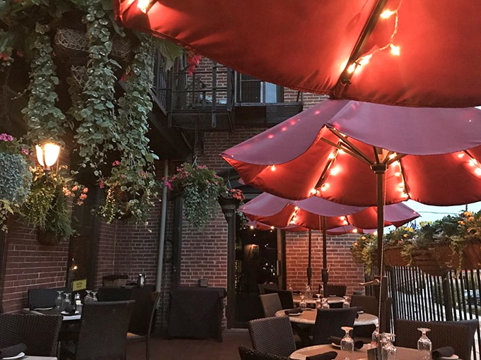 The outdoor patio, where brick walls and twinkling lights create the perfect backdrop for summer evenings and whispered conversations.