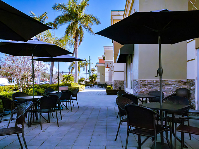 Florida dining done right&mdash;outdoor seating under palm trees where the morning breeze accompanies your coffee and pancakes perfectly.
