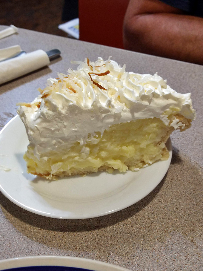 Coconut cream pie with a mile-high meringue&mdash;the kind of dessert that makes you seriously consider ordering a second slice before finishing the first.