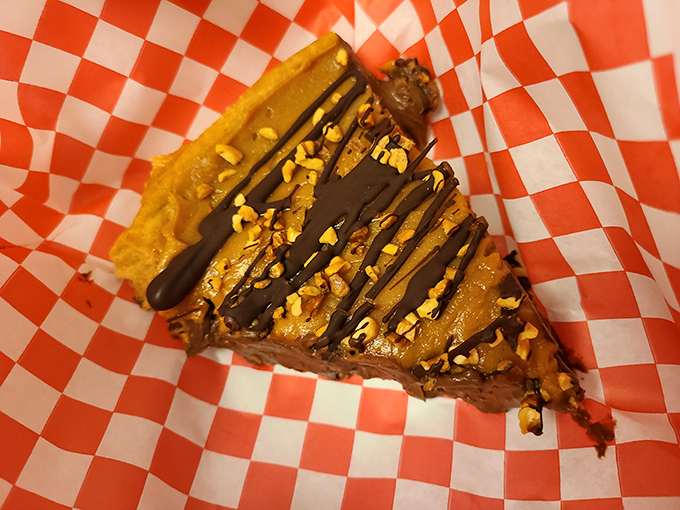 A slice of pie with chocolate drizzle proves that Crawford's understands the fundamental truth: every chicken feast deserves a sweet finale.