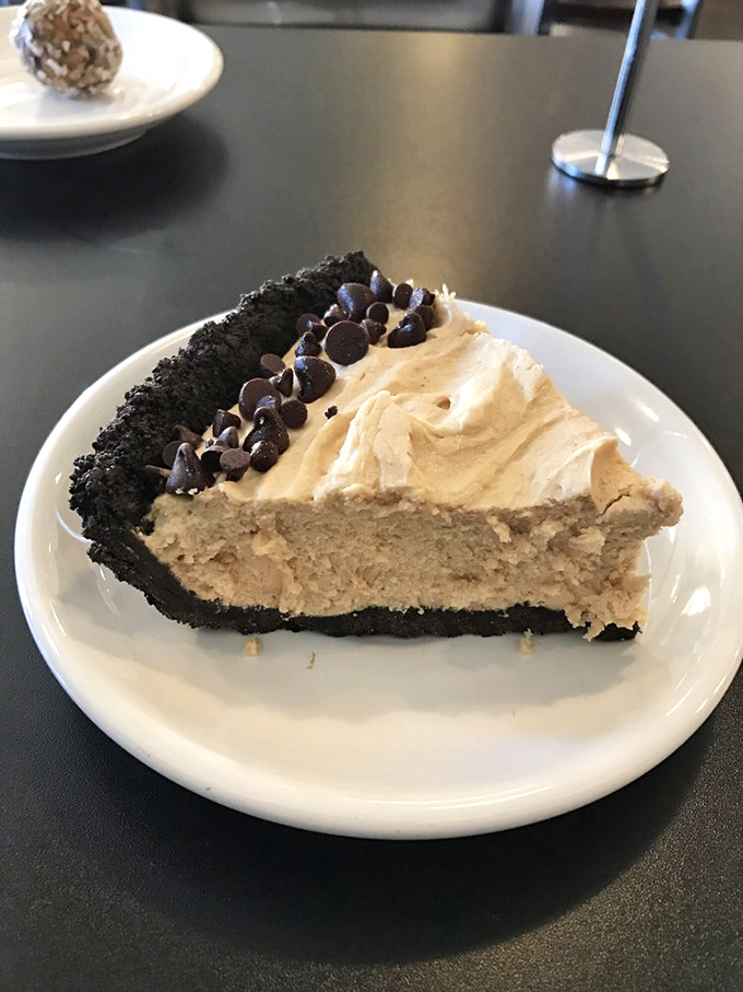This isn't just pie—it's a chocolate-studded peanut butter dream with an Oreo crust that makes you wonder why anyone bothers with birthday cake.