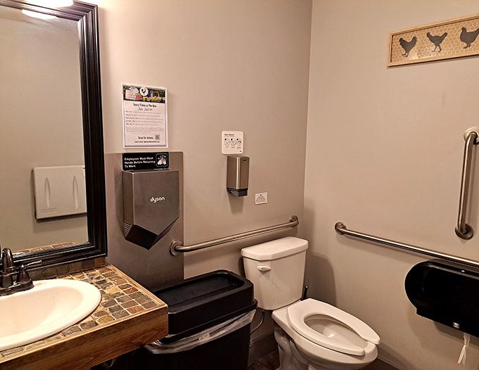 Even the restroom continues the hen theme, proving that at Speckled Hen, attention to detail extends to every corner of the establishment.