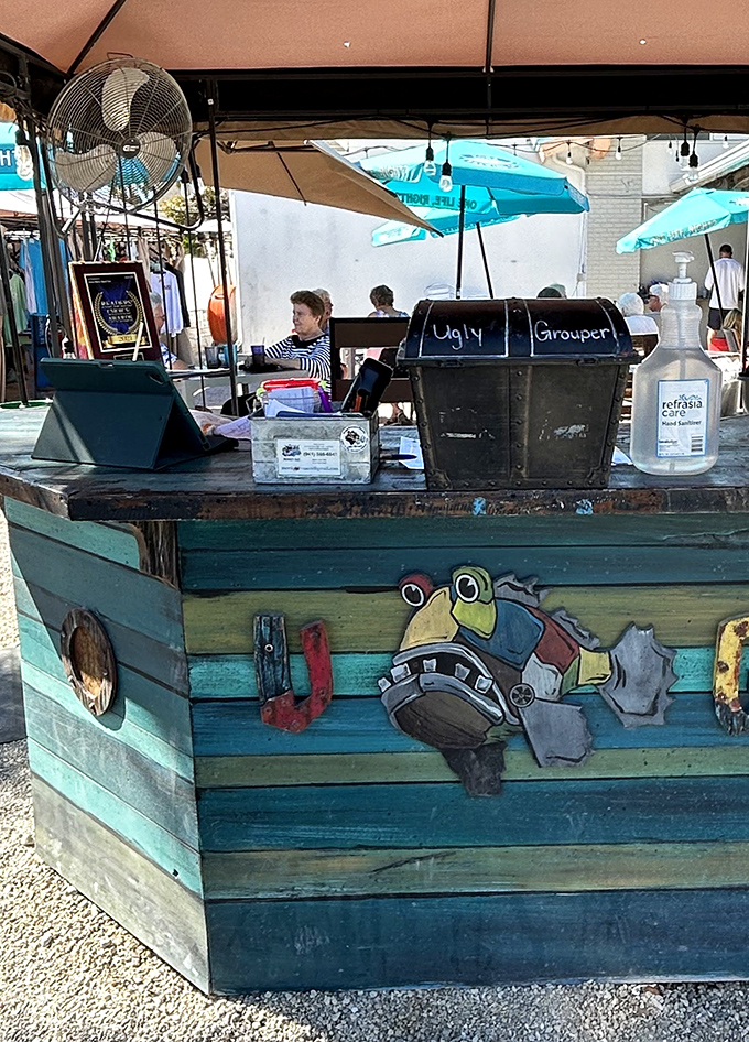 This whimsical host station, adorned with the restaurant's signature grouper, sets the tone for the playful experience that awaits beyond.