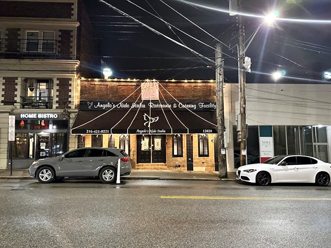 As night falls, Angelo's Nido Italia glows like a beacon on Mayfield Road, drawing in those seeking authentic Italian cuisine in Cleveland's Little Italy.