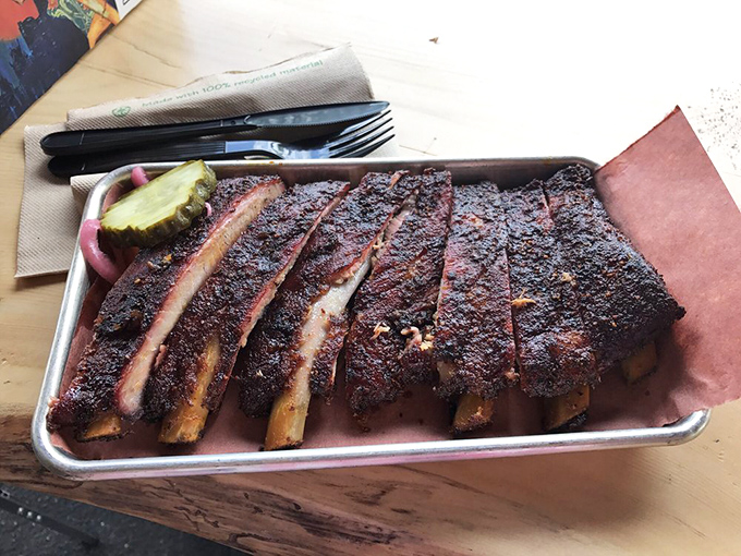 Ribs with that perfect bark and pink smoke ring&mdash;the kind that make vegetarians question their life choices, if only for a moment.