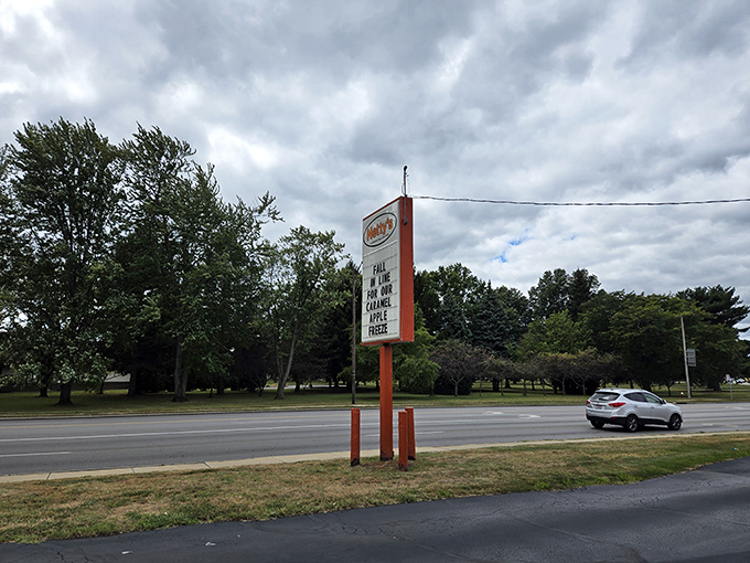 Even the road sign has that perfect retro charm. No flashy digital displays needed when you've been a landmark for decades.