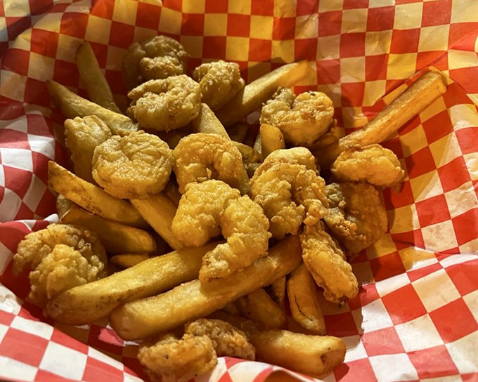 Fried shrimp nestled among golden fries – comfort food with a coastal accent. The kind of basket that makes you wonder why you ever eat anything else.