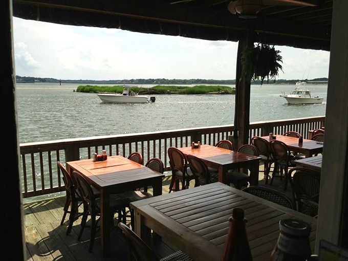Tables with a view that makes conversation optional – the Lynnhaven Inlet providing dinner theater that no Broadway show could match.