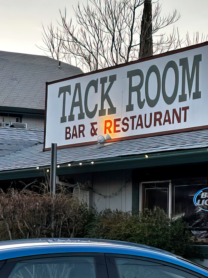 As evening falls, the Tack Room sign glows with promise&mdash;a beacon for hungry travelers and locals alike seeking honest-to-goodness deliciousness.