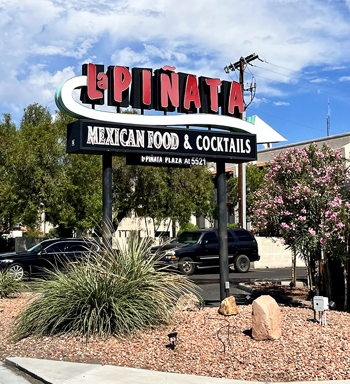 The classic roadside sign beckons like a beacon, promising authentic Mexican flavors just steps away from busy Phoenix streets.