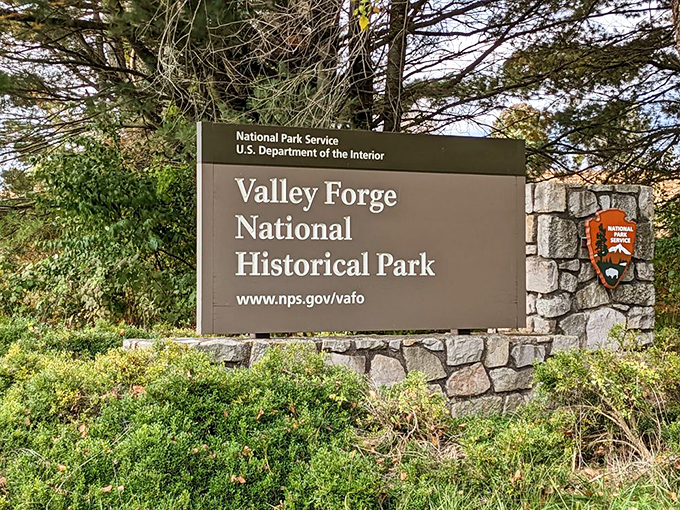 The park's entrance sign welcomes visitors to step into America's story, where history happened and legends were born.