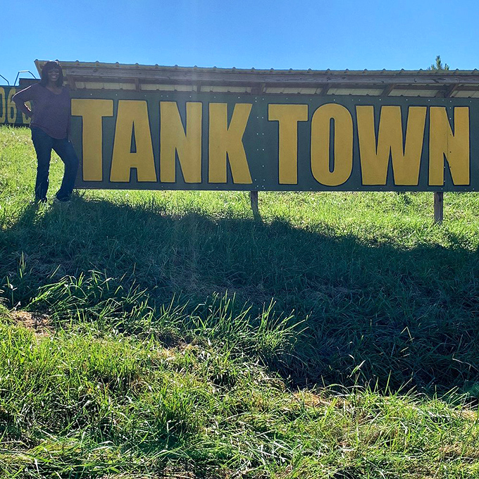 The entrance sign promises exactly what it delivers &ndash; a town of tanks. No false advertising here, just 60 tons of tracked adventure waiting beyond.