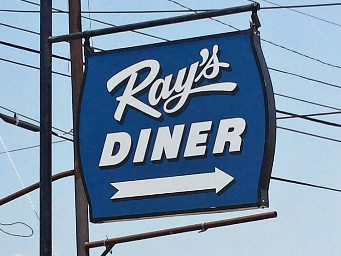 Follow the blue arrow to breakfast paradise. This roadside sign has guided hungry travelers for years, a landmark of culinary promise.