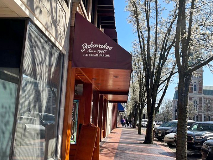 Spring blossoms frame the iconic burgundy awning, creating a postcard-perfect scene that's been drawing visitors to downtown Columbus for generations.