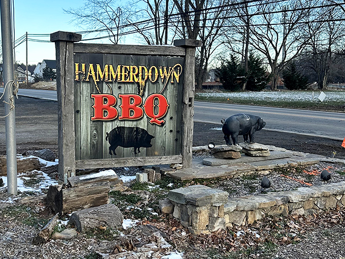 The roadside sign announces your arrival at meat paradise. That pig statue isn't decoration&mdash;it's a greeter, a mascot, and a promise of deliciousness to come.