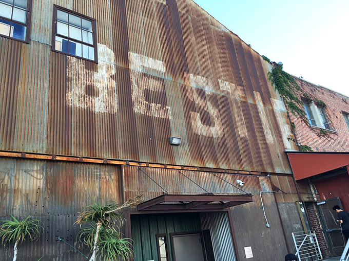 The weathered metal exterior proudly wears the Bestia name like a badge of honor&mdash;a culinary fortress in LA's concrete jungle.