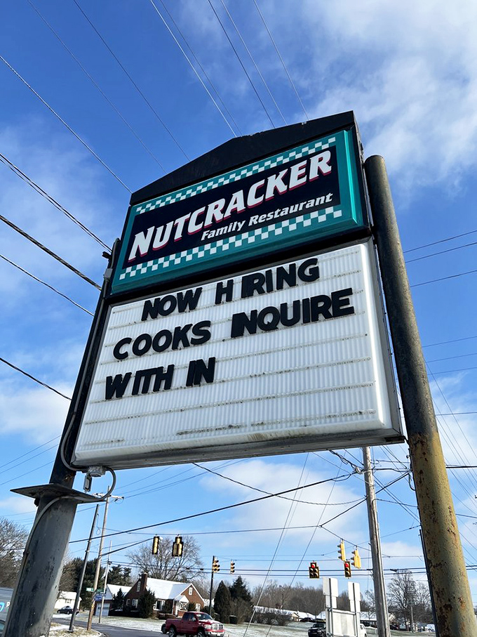 The roadside sign stands as a beacon to hungry travelers, promising a journey back in time that begins with your appetite and ends with satisfaction.